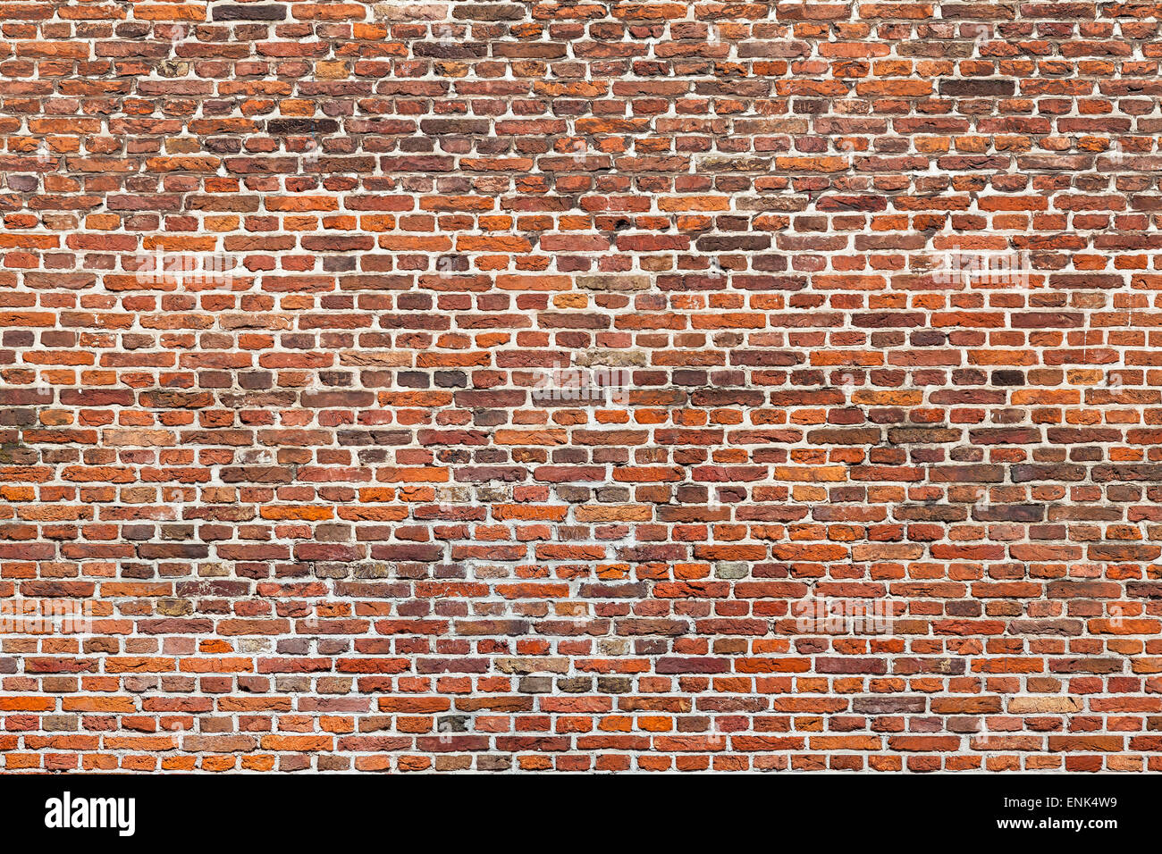 Big wide wall of bright and dark red bricks Stock Photo - Alamy