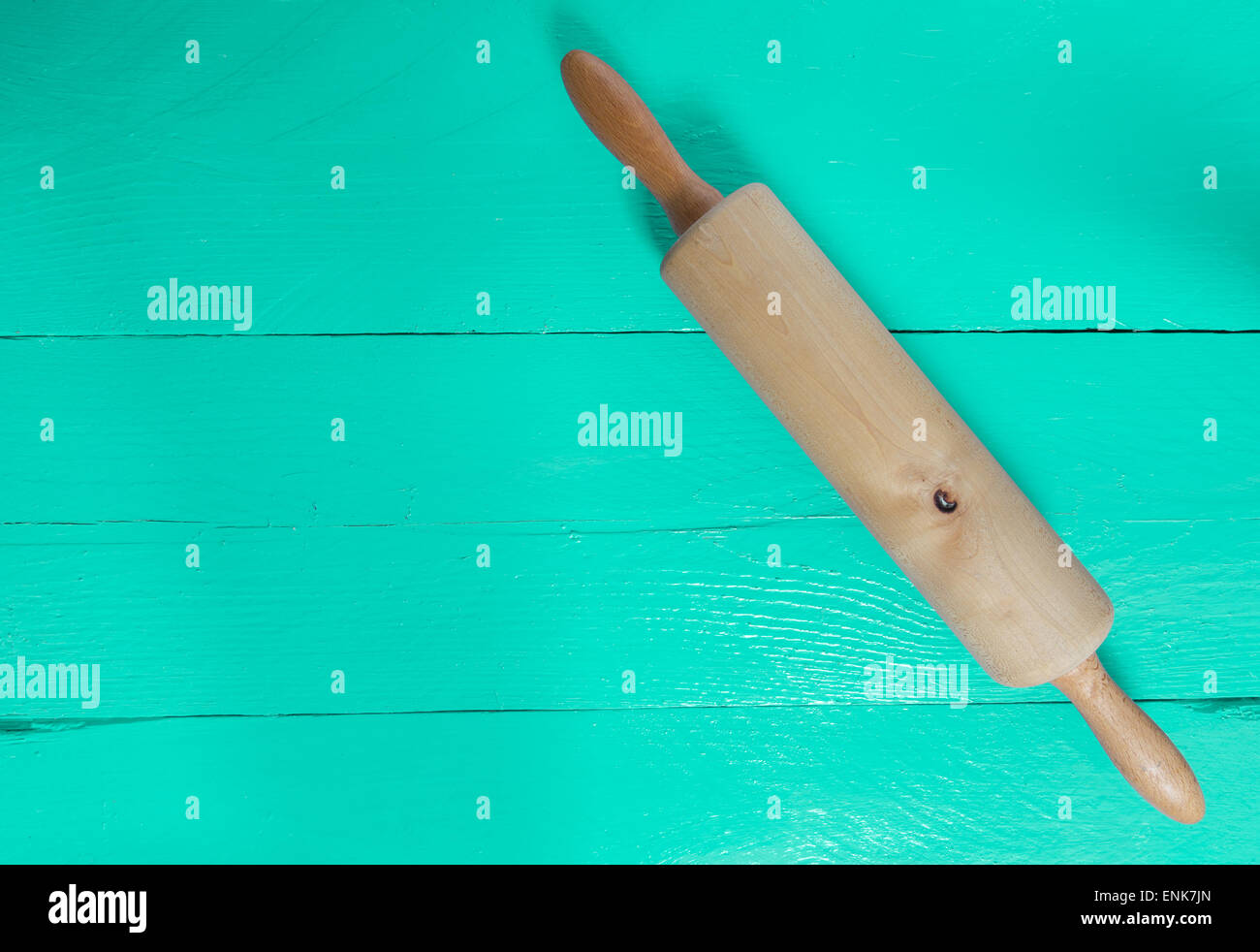 Rolling pin on turquoise wood as background Stock Photo - Alamy