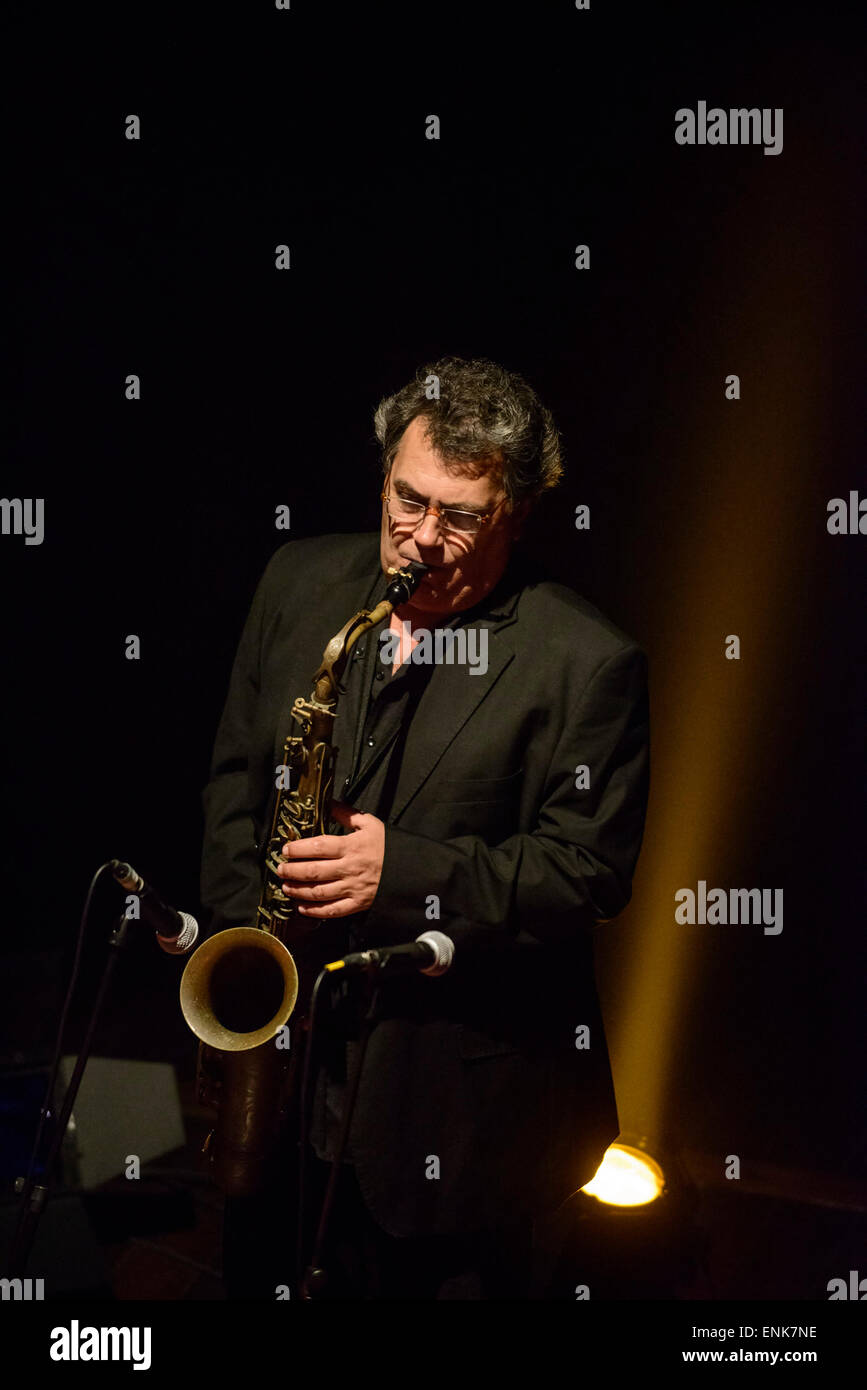 Saxophone player performing on stage during a concert Stock Photo - Alamy