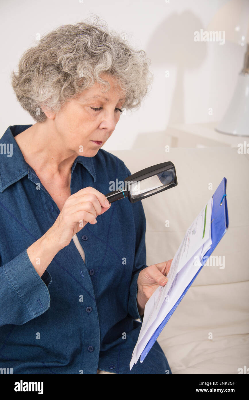 Magnifying glass reading adult hi-res stock photography and images - Alamy