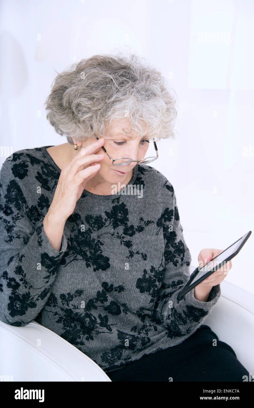 Old woman reading glasses computer hi-res stock photography and images ...