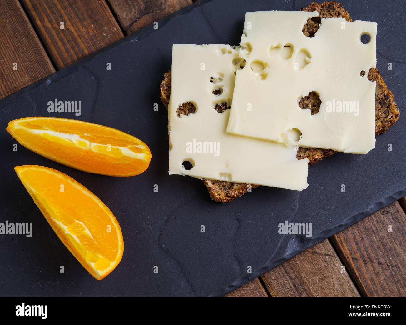 wholemeal rye bread with cheese and orange slice Stock Photo - Alamy