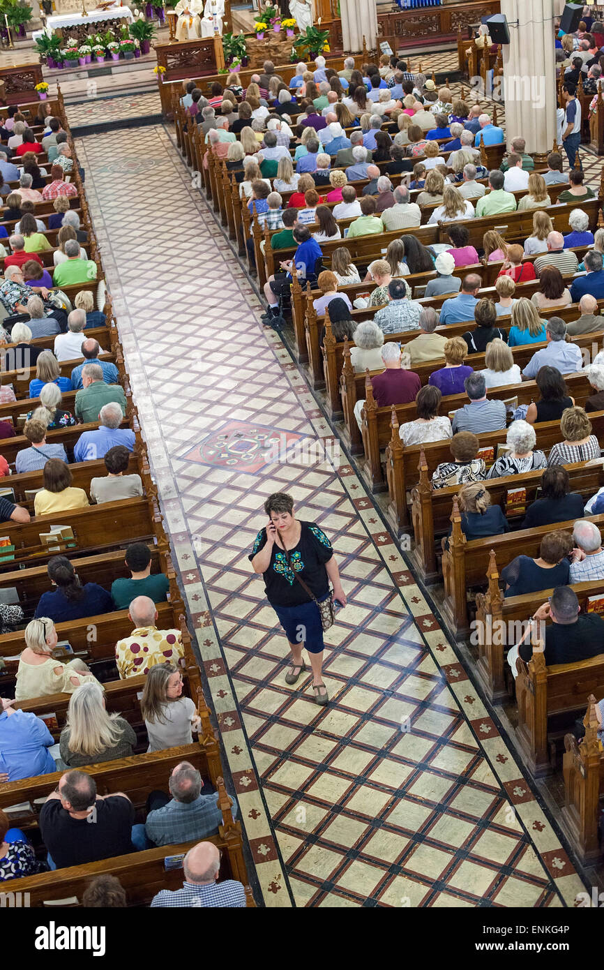 Detroit, Michigan - A woman talks on her cell phone as a "mass mob ...