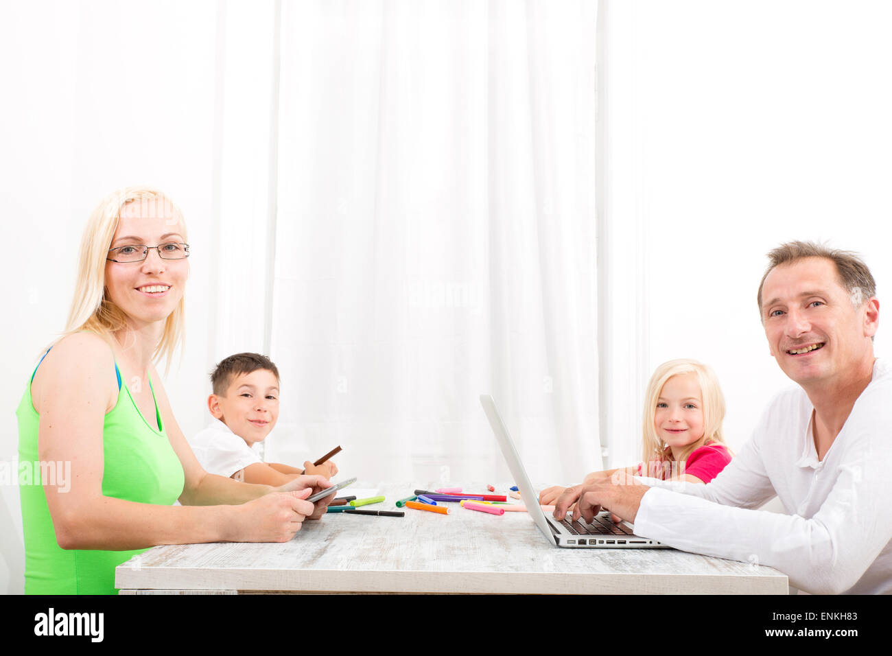 A family performing various activities at home Stock Photo - Alamy