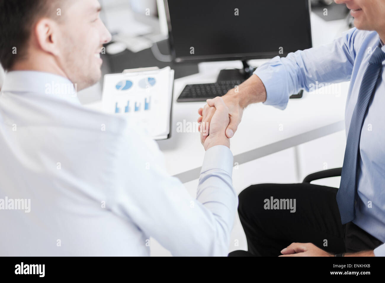 businessmen shaking hands in office Stock Photo - Alamy