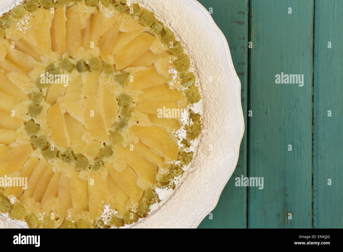Rhubarb apple vanilla sponge cake on white plate and turquoise ...