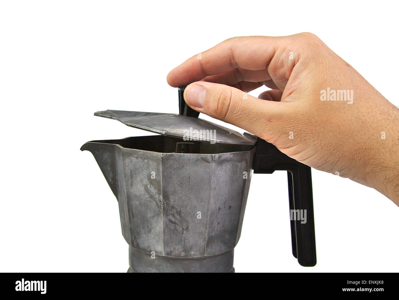 Caucasian man hand opening an old, used and rusty italian coffee maker ...