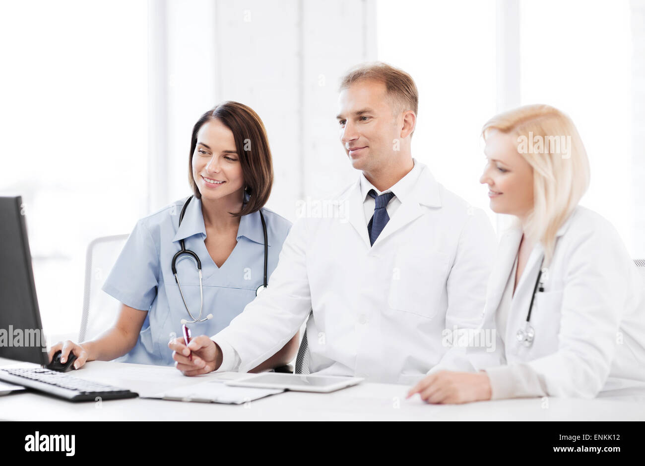 doctors looking at computer on meeting Stock Photo - Alamy