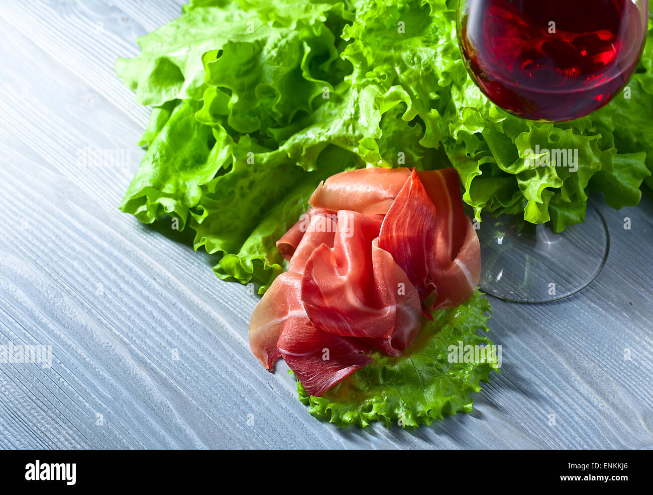 jamon and red wine on wooden table Stock Photo - Alamy