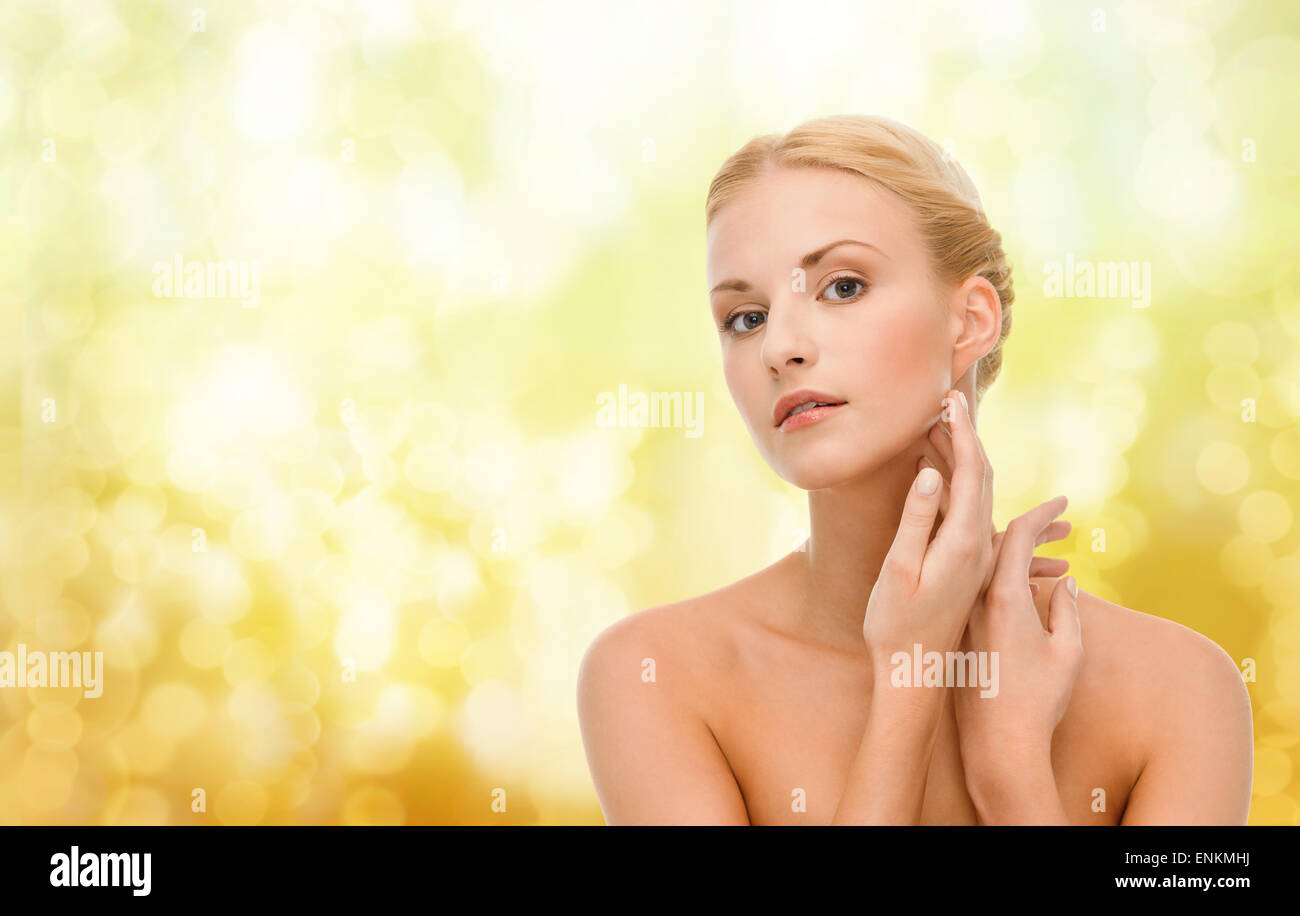 beautiful woman touching her face skin Stock Photo - Alamy