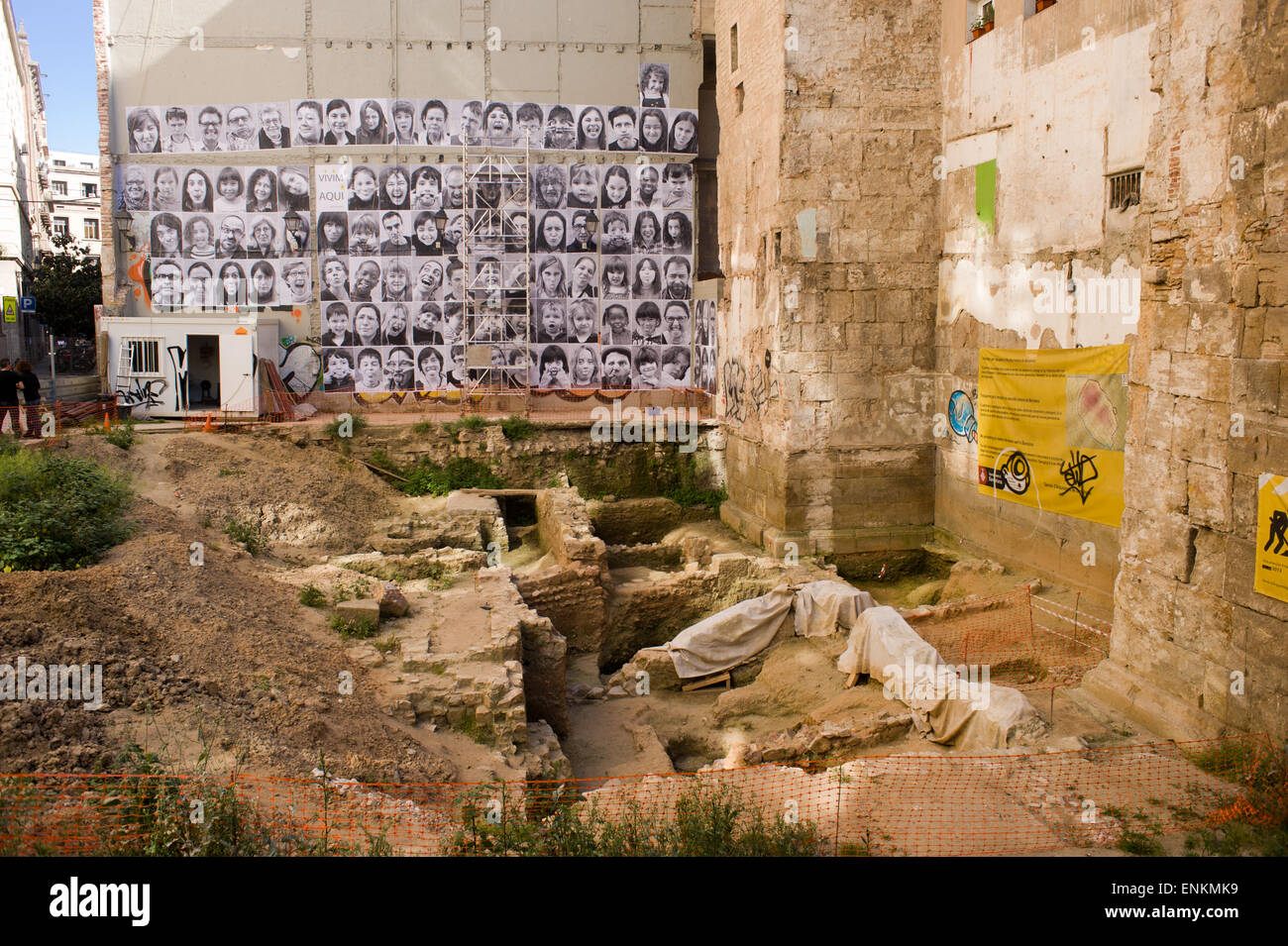 Pictures of faces of local people from the old part of Barcelona are ...