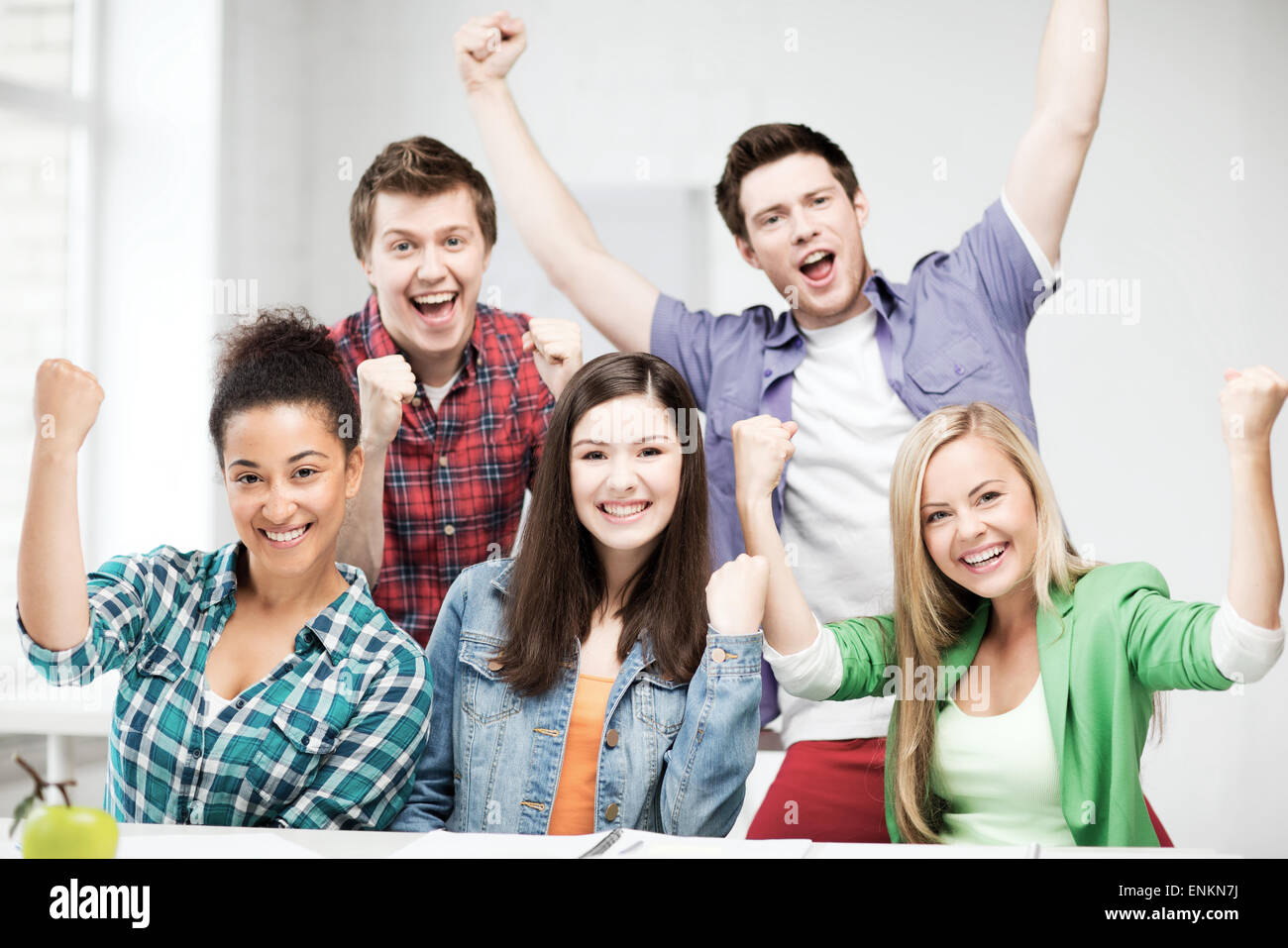 students holding hands up at school Stock Photo - Alamy