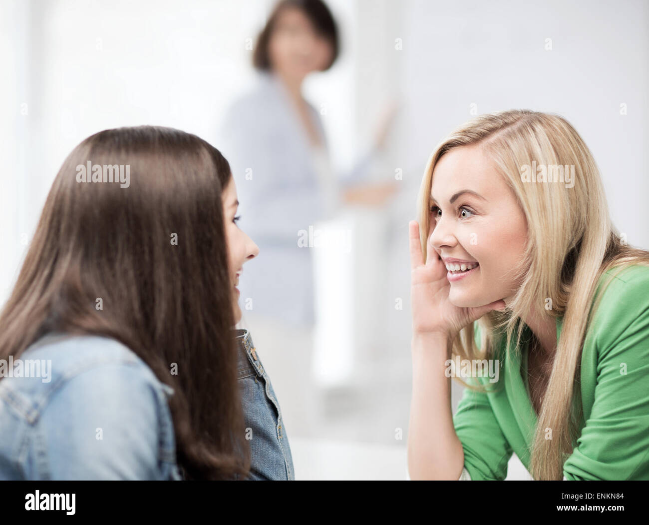 student girls gossiping at school Stock Photo - Alamy