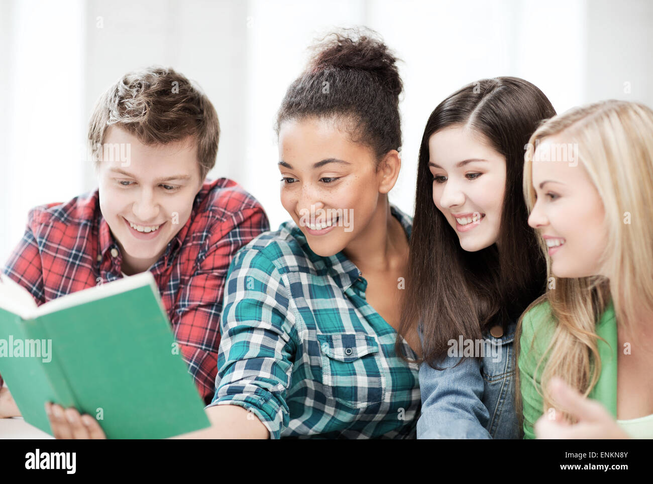 students reading book at school Stock Photo - Alamy