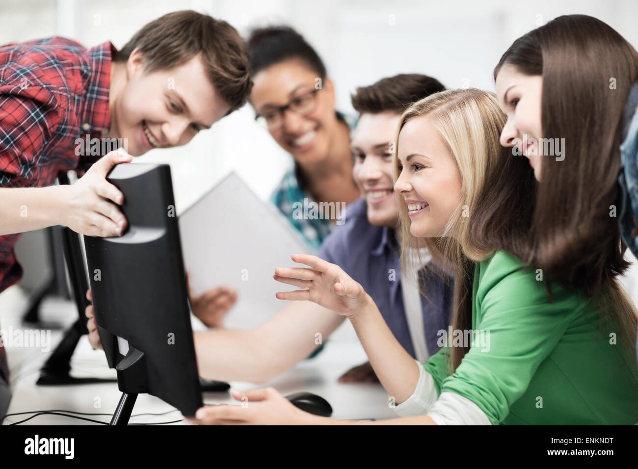 students looking at computer monitor at school Stock Photo - Alamy