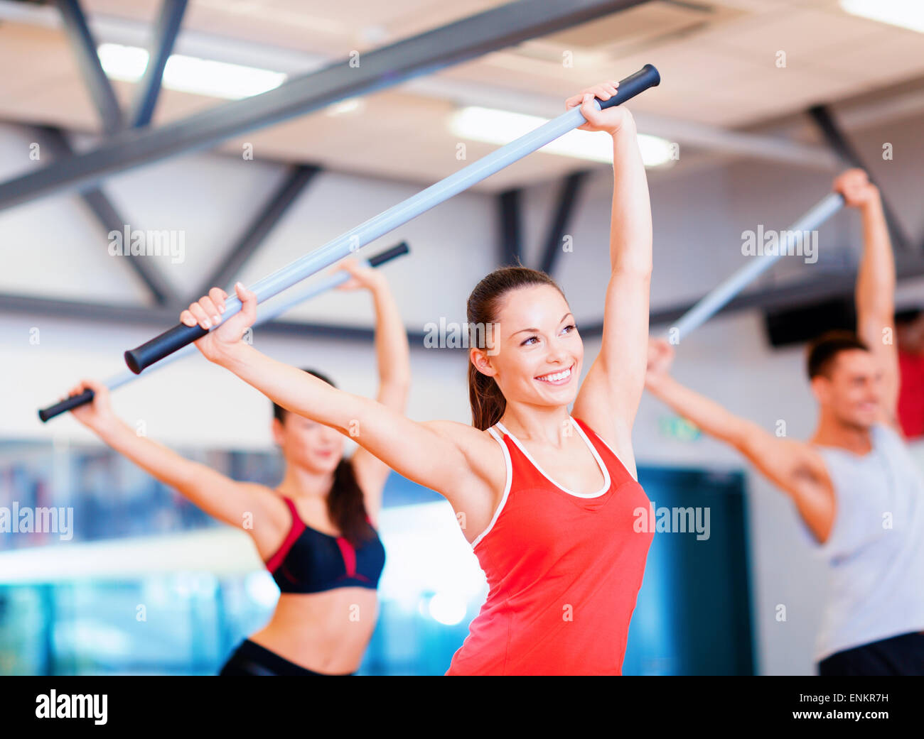 group of smiling people working out with barbells Stock Photo - Alamy