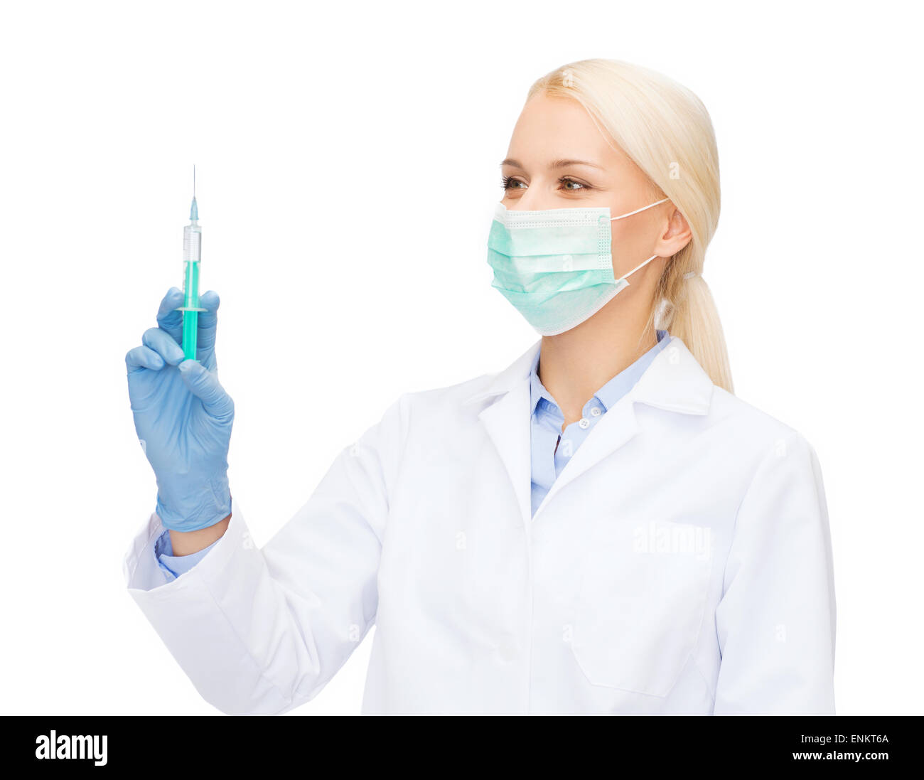 doctor in mask holding syringe with injection Stock Photo - Alamy