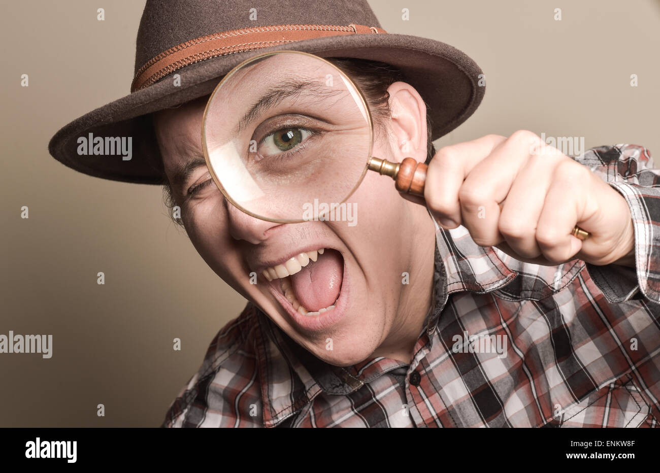 Explorer with Magnifying Glass Stock Photo - Alamy