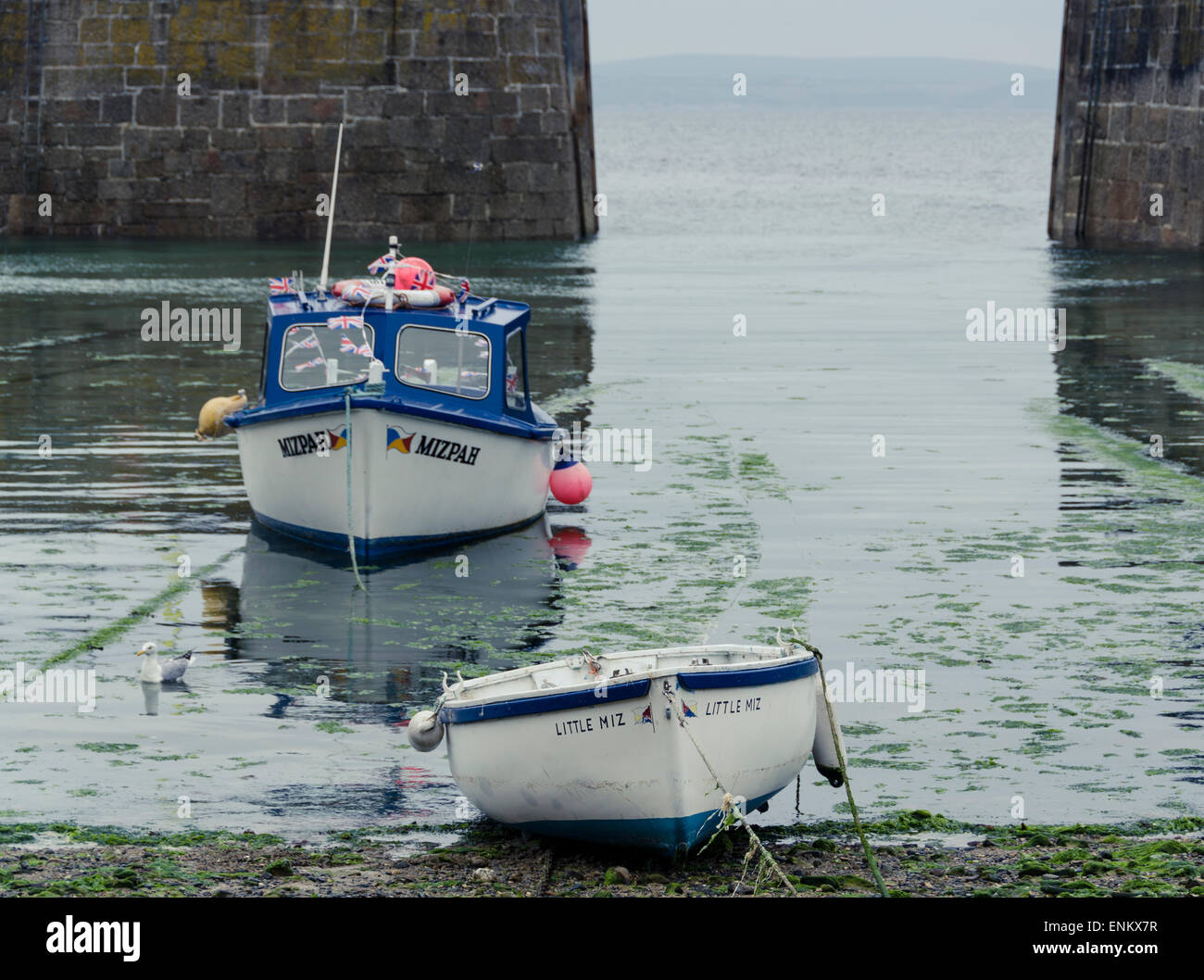 Cornish fishing village of Mousehole with its pretty harbour at low ...