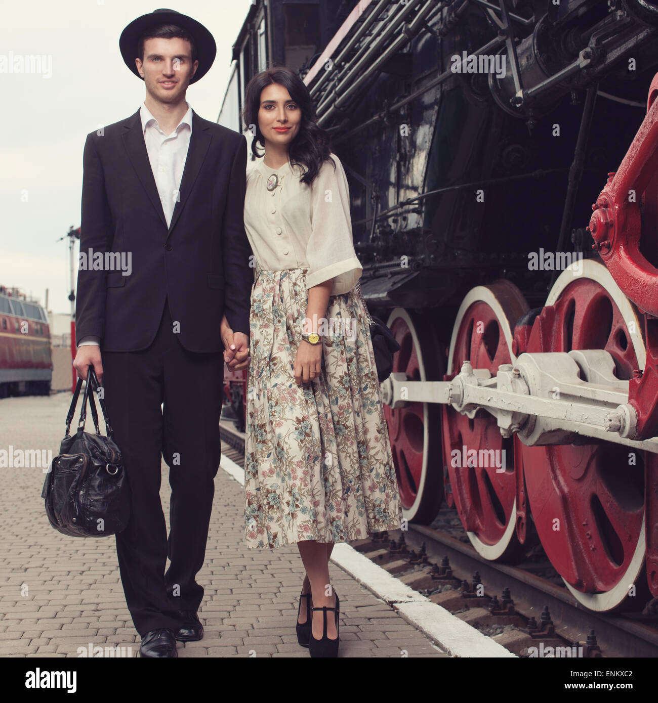parting of stylish couple of traveler on railway station Stock Photo ...