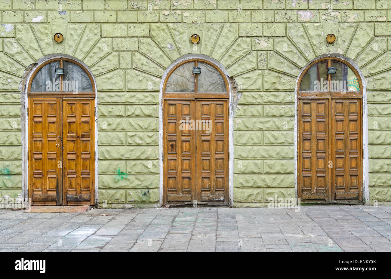 Three entrance - doors in old building Stock Photo - Alamy