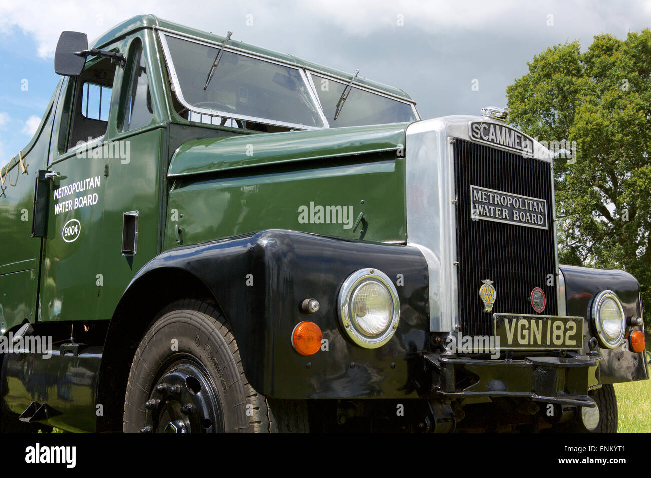 Low angle view of a monster vintage commercial truck. Big green ...
