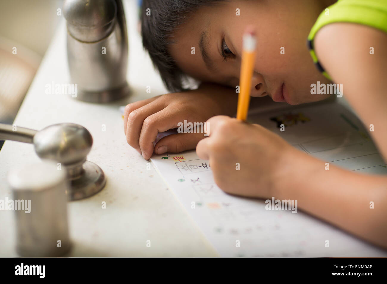A Japanese boy studies Japanese homework in a kitchen Stock Photo - Alamy