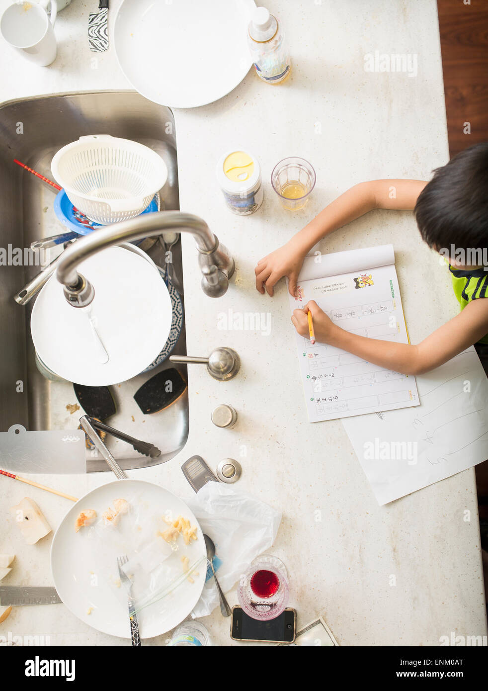 A Japanese boy studies Japanese homework in a kitchen Stock Photo - Alamy