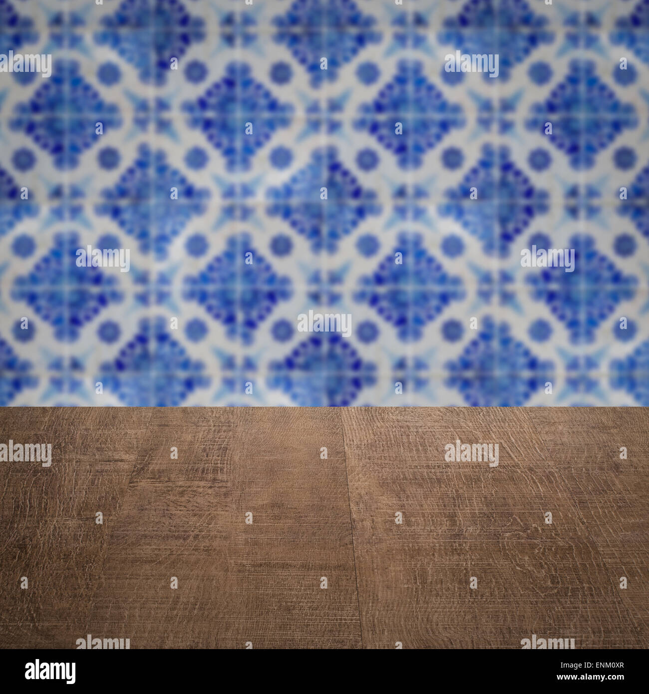 Empty wood table top and blur vintage ceramic tile pattern wall in ...