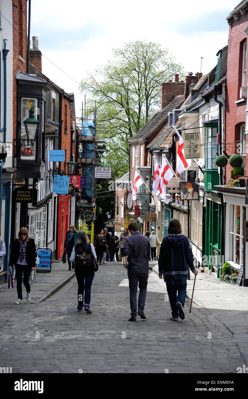 People walking in spring sunshine on Steep Hill, Lincoln Stock Photo ...