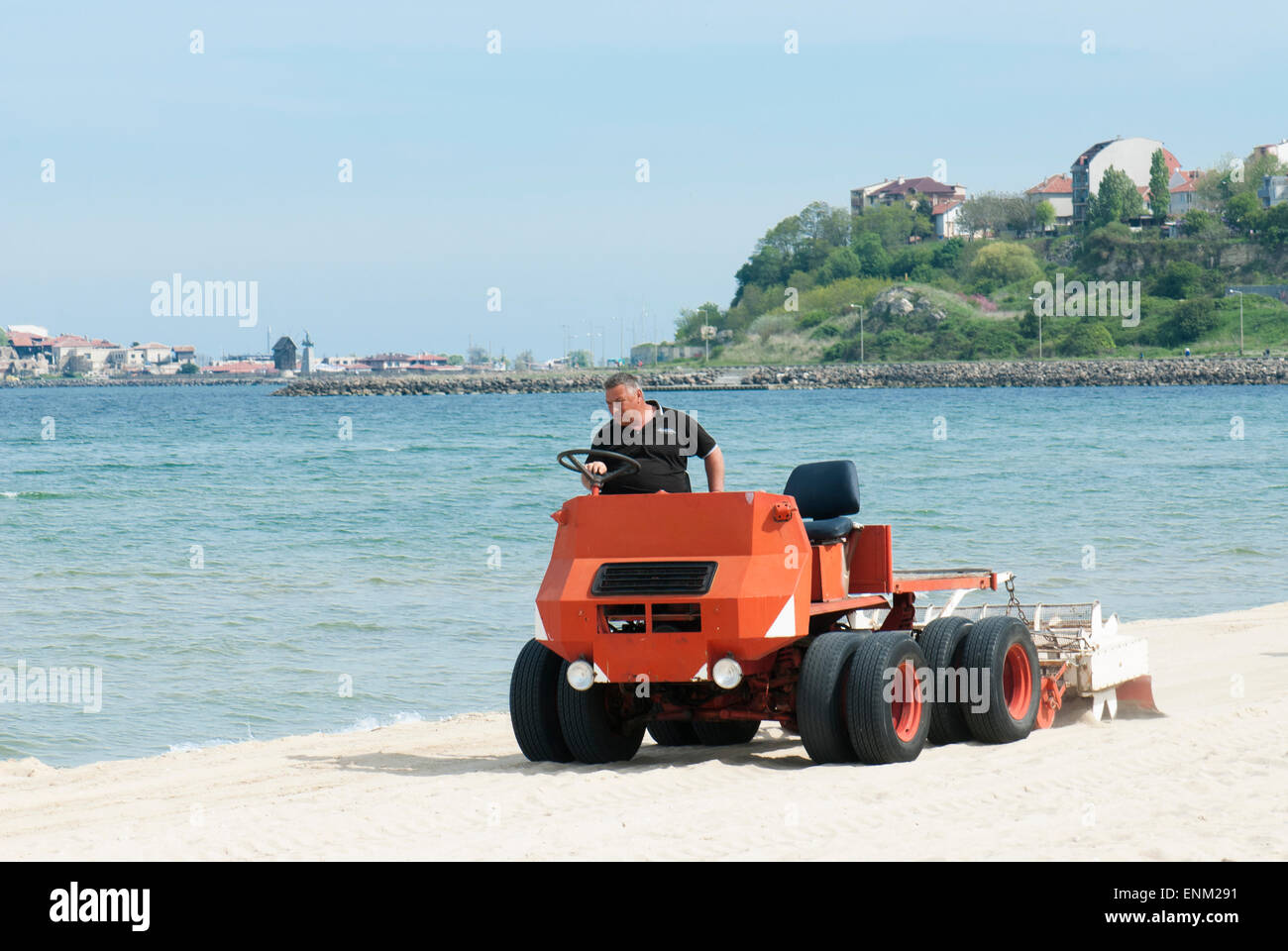 Grader on the beach Stock Photo - Alamy