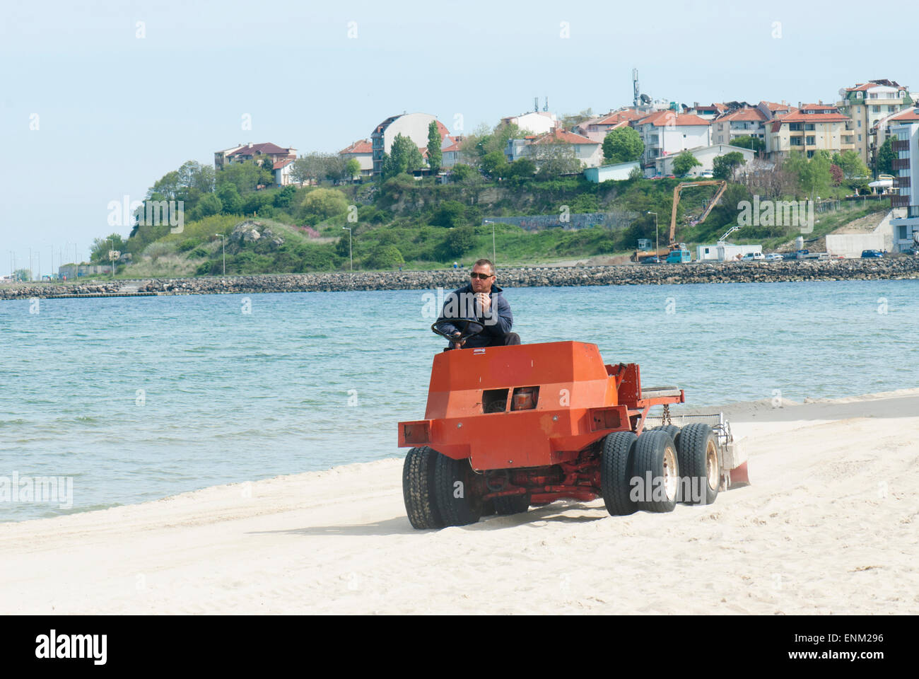 Grader on the beach Stock Photo - Alamy
