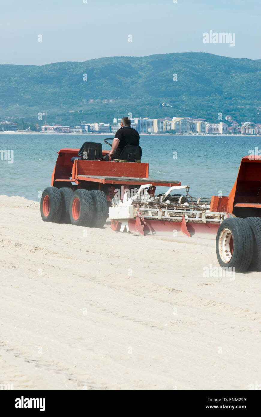 Grader on the beach Stock Photo - Alamy