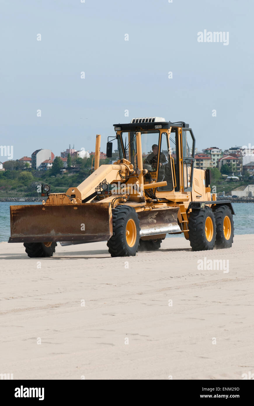 Grader on the beach Stock Photo - Alamy