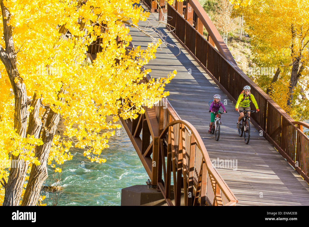 A mother and daughter mountain biking on the Animas River Trail in ...