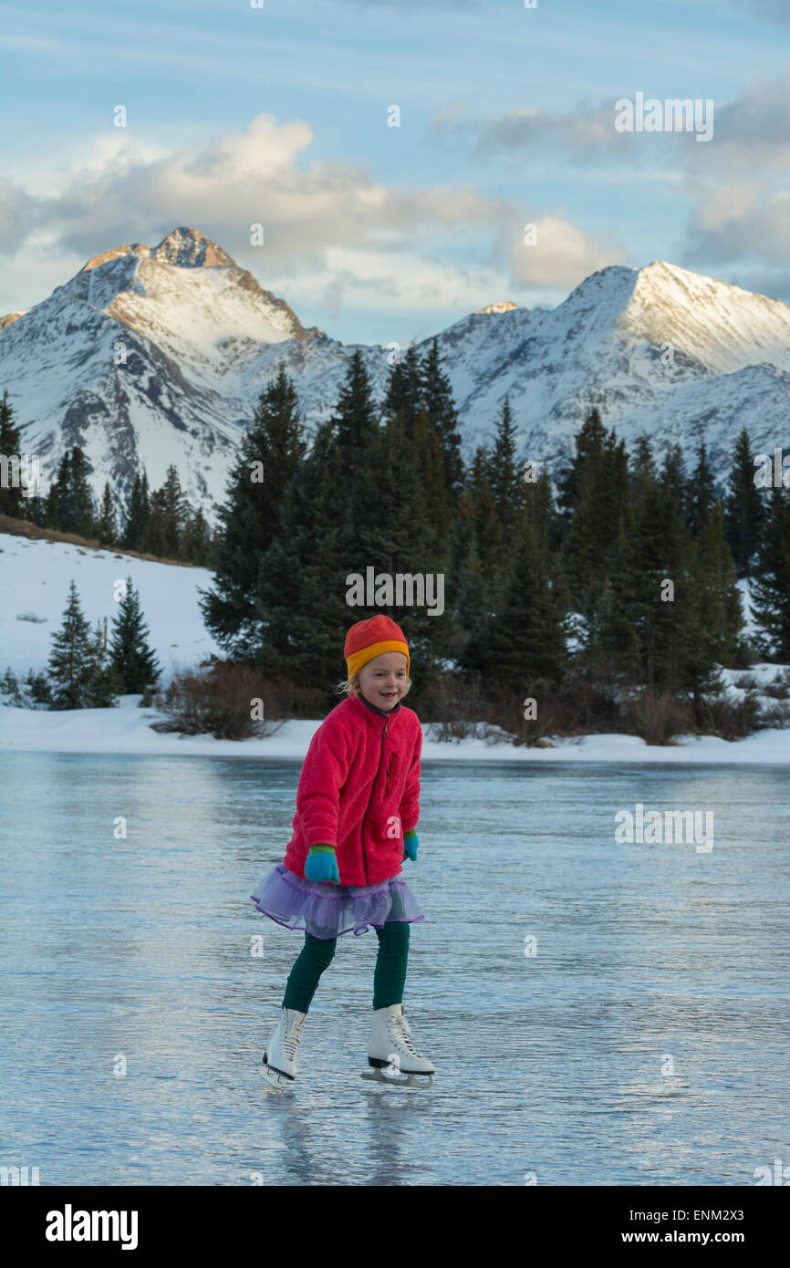 A girl ice skating on Molas Lake, San Juan National Forest, Silverton ...