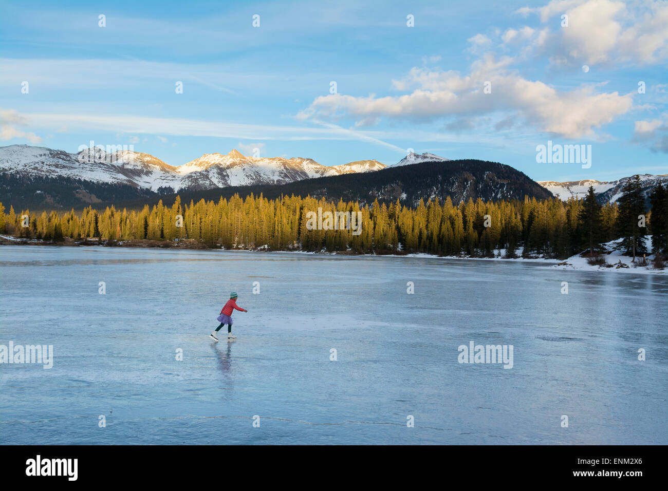 A girl ice skating on Molas Lake, San Juan National Forest, Silverton ...