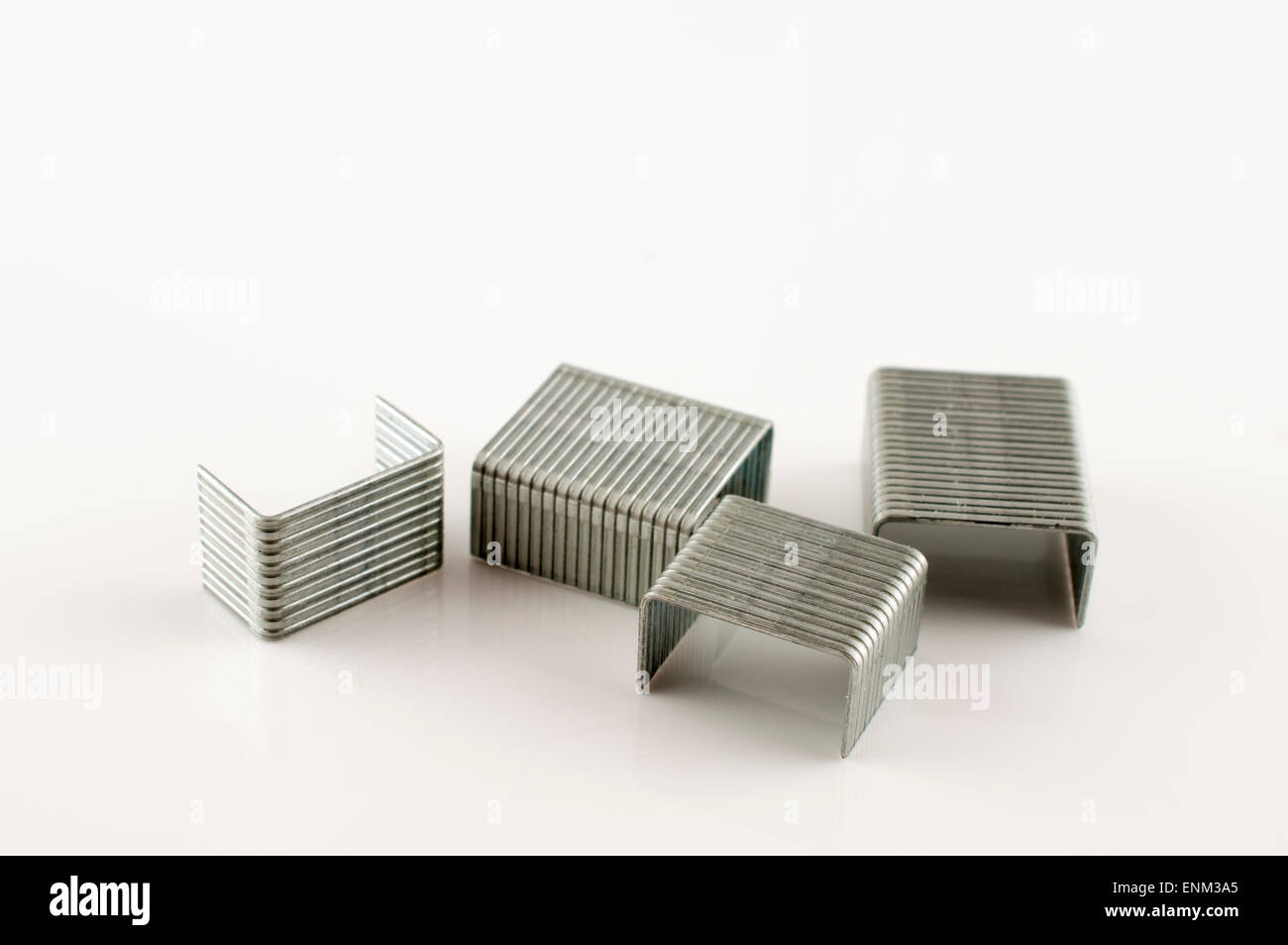 Staples isolated on white background with shadows Stock Photo - Alamy