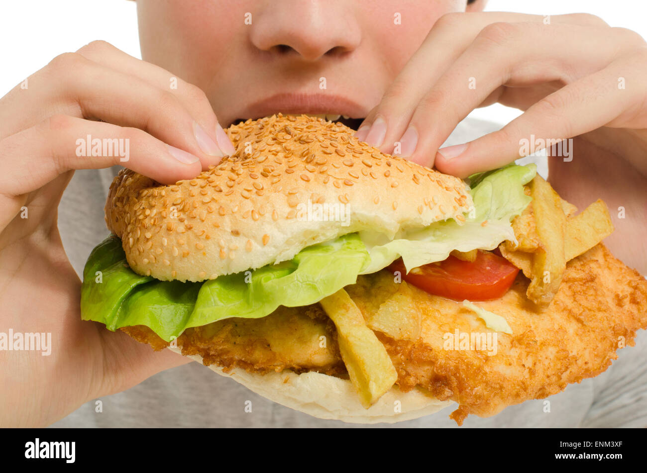 Close up of a man eating a big hamburger, fast food unhealthy burger ...