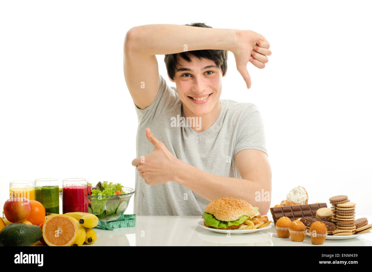 Man choosing between fruits, smoothie and organic healthy food against ...