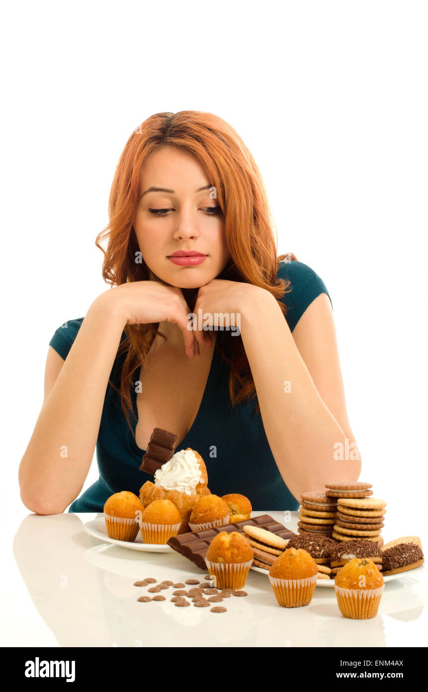 Woman eating lots of sweets hi-res stock photography and images - Alamy