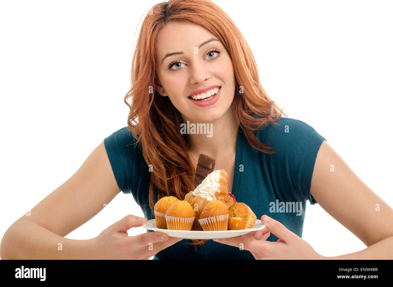 Girl having fun and eating lots of biscuits, muffins, fondants. Woman ...