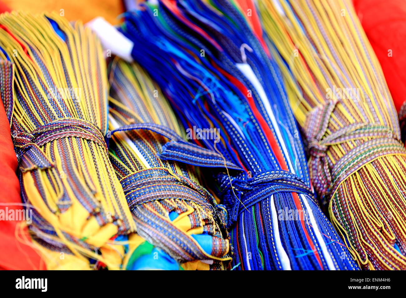 Pack of reels of manycolored buddhist prayer flags-shop in a street in ...