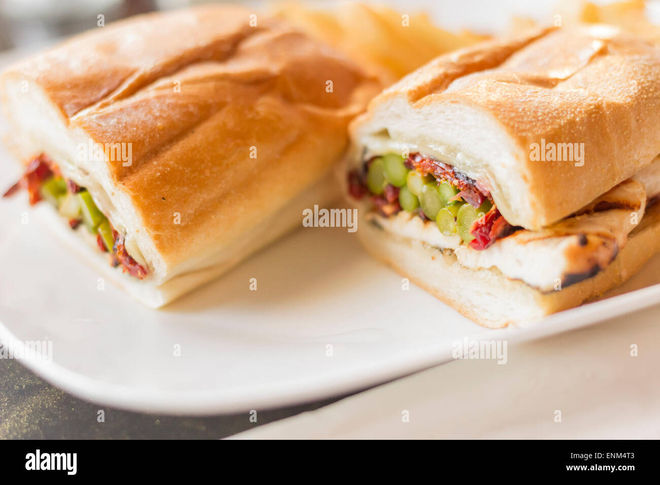 Healthy and filling grilled chicken and asparagus sandwich on a torpedo ...