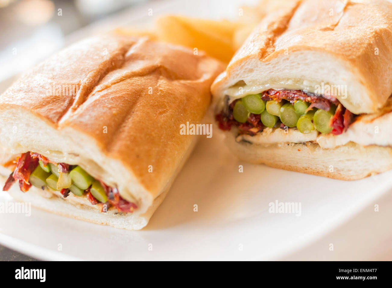 Healthy and filling grilled chicken and asparagus sandwich on a torpedo ...