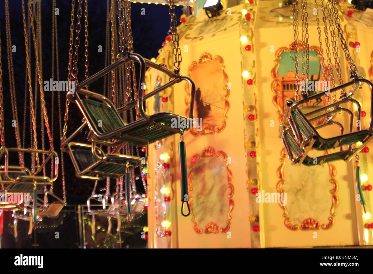 fairground funfair ride moving fast fair lights Night colours of the ...