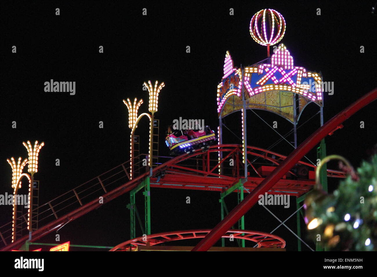 fairground funfair ride moving fast fair lights Night colours of the ...