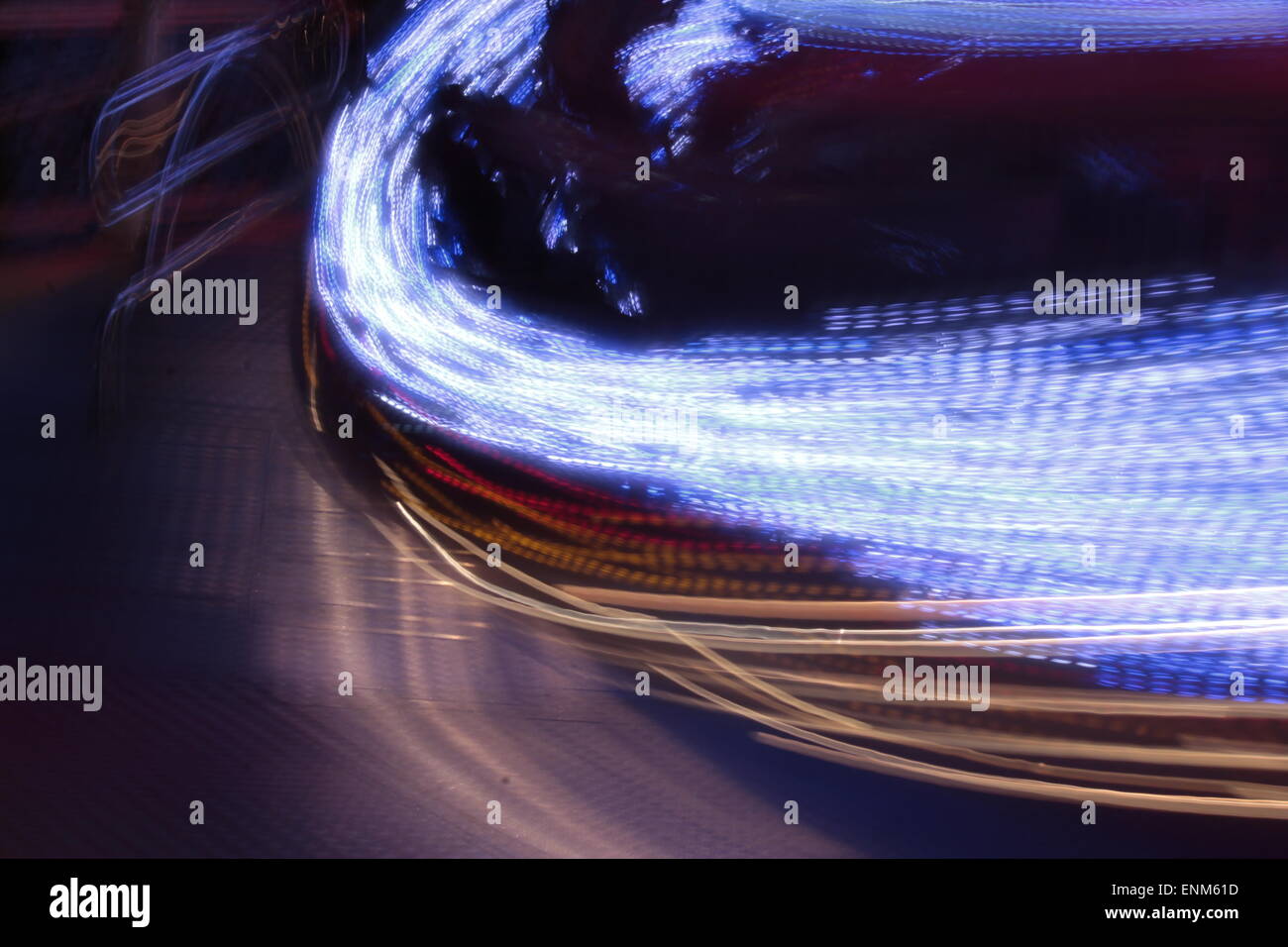 fairground funfair ride moving fast fair lights Night colours of the ...