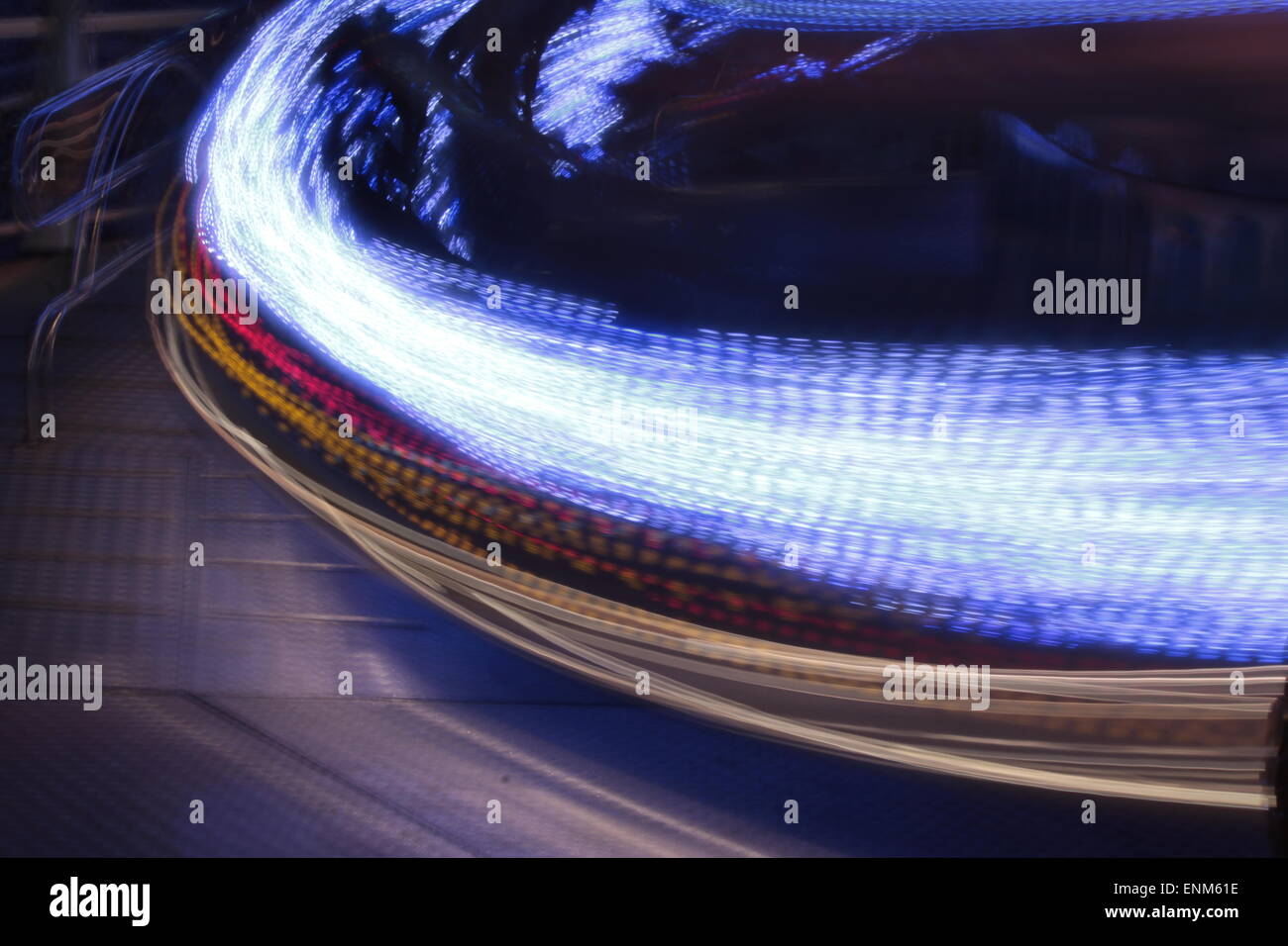 fairground funfair ride moving fast fair lights Night colours of the ...