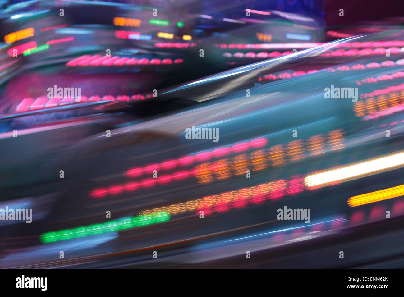 fairground funfair ride moving fast fair lights Night colours of the ...
